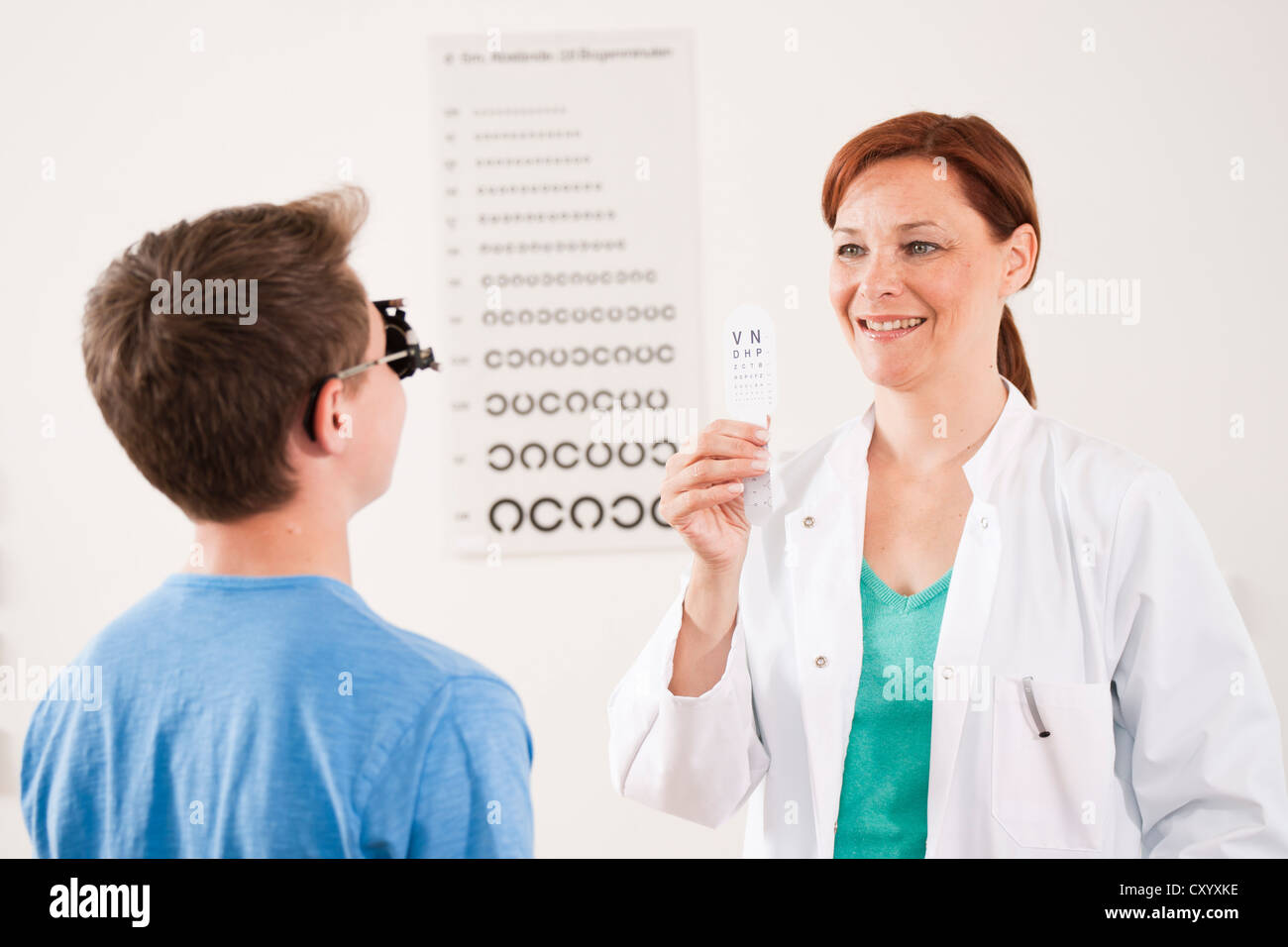Physician examining teen boy hi-res stock photography and images - Alamy