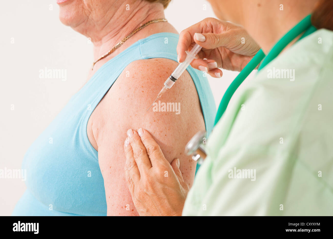 Patient receiving an injection from her doctor, vaccination Stock Photo ...
