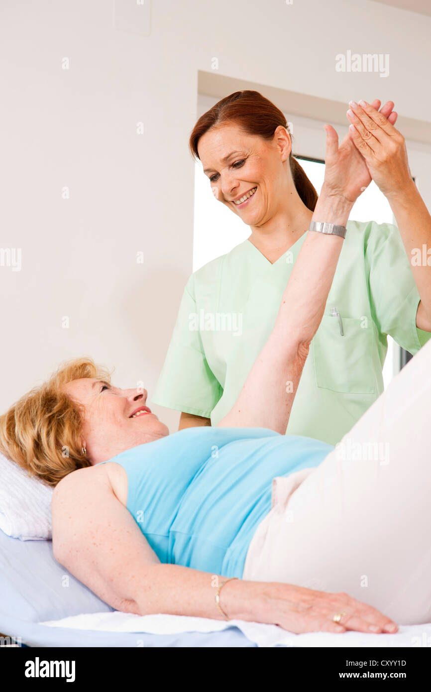 Patient being treated on her arm by a physiotherapist Stock Photo - Alamy