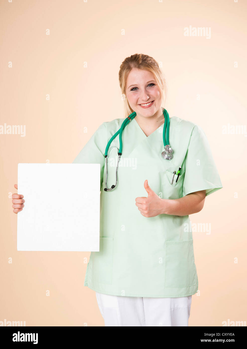 Nurse holding a white board Stock Photo - Alamy