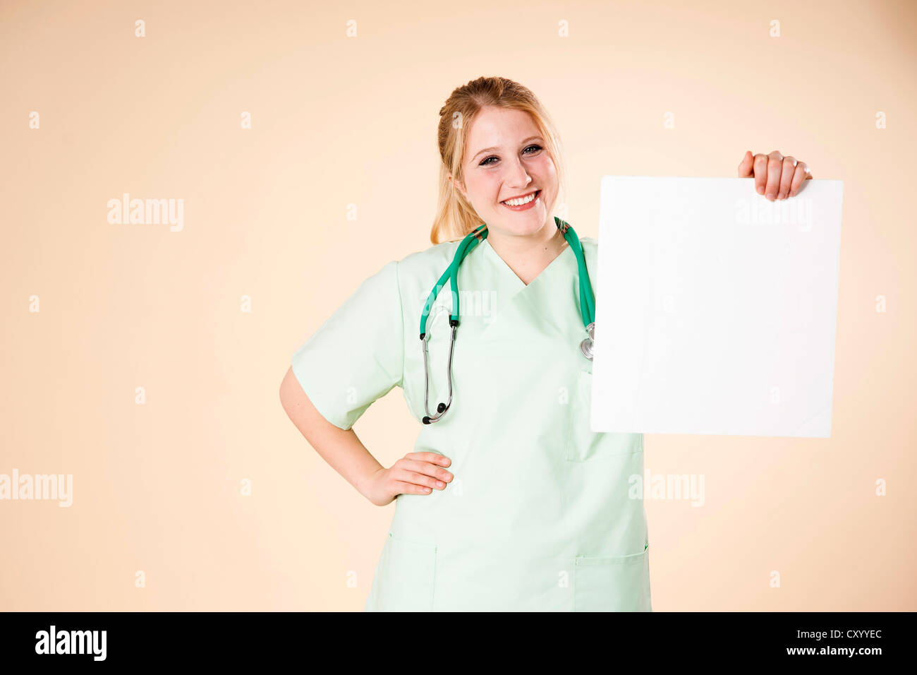 Nurse holding a white board Stock Photo - Alamy