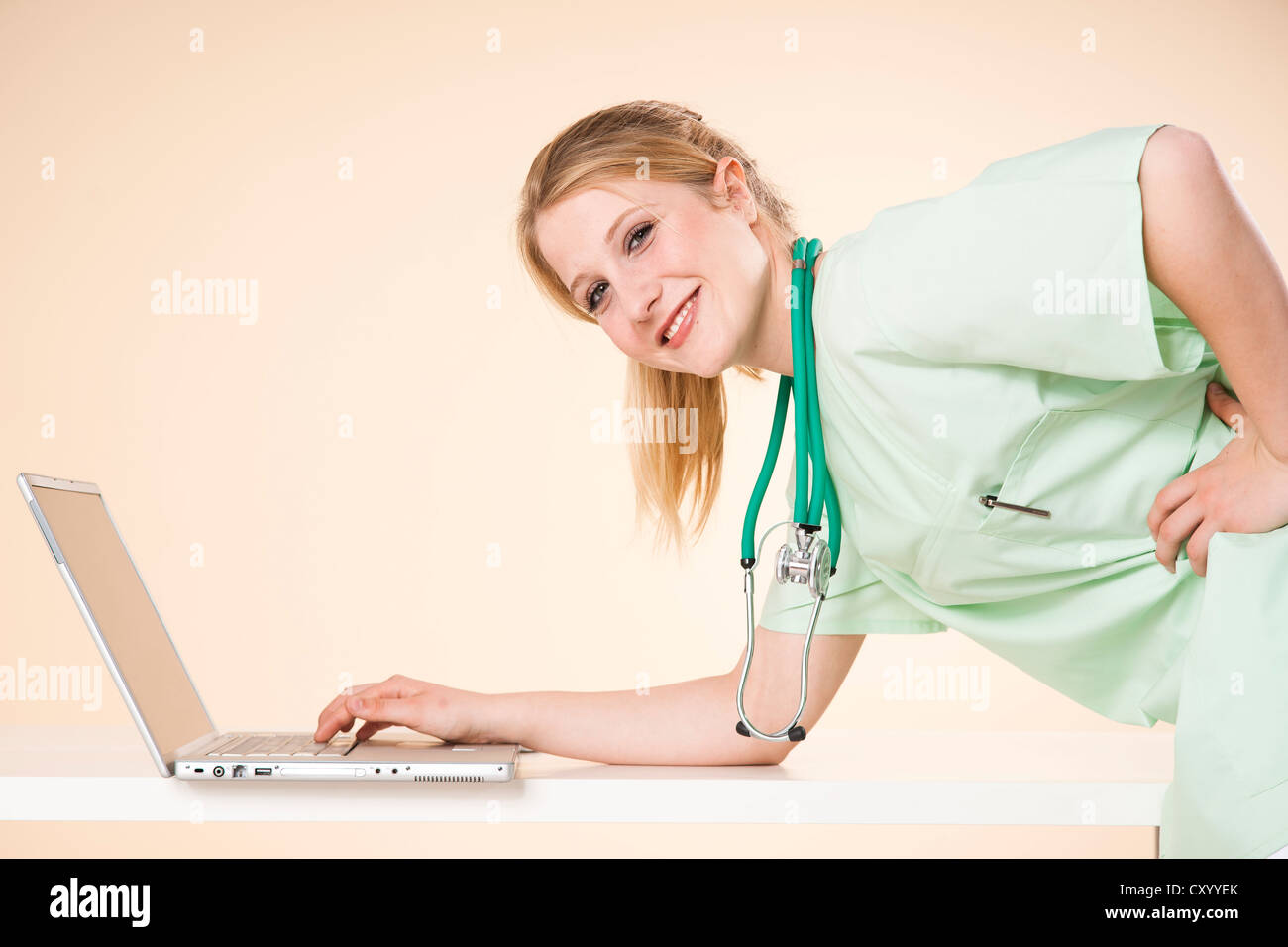 Nurse working on a laptop Stock Photo - Alamy