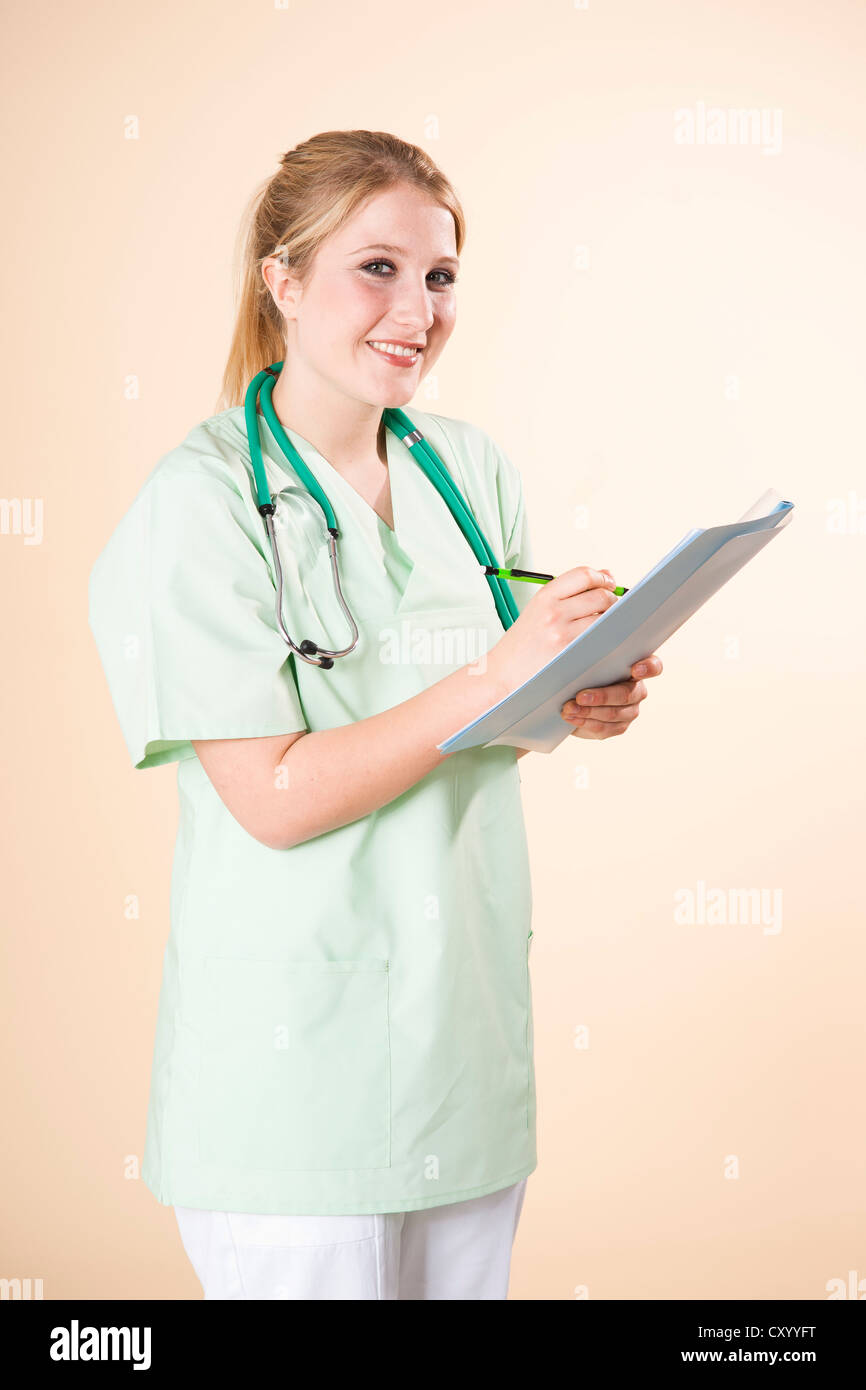 Nurse taking notes Stock Photo - Alamy