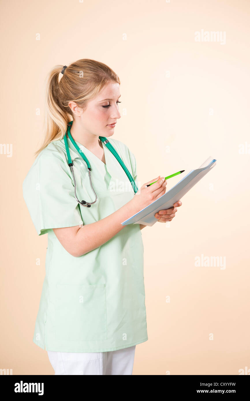 Nurse taking notes Stock Photo - Alamy