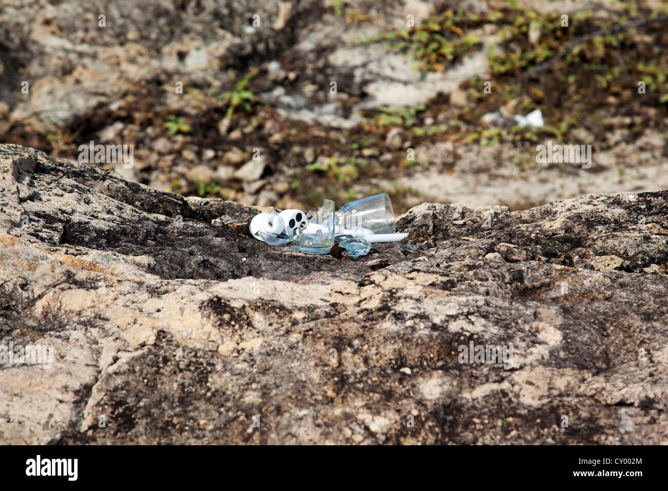 Broken glass on rock Stock Photo - Alamy