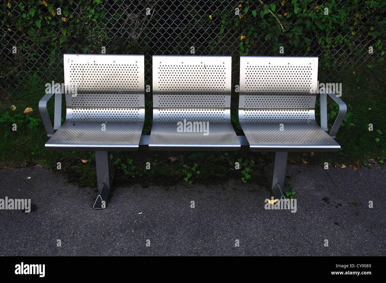 Three practical seats on a railway station platform UK Stock Photo - Alamy