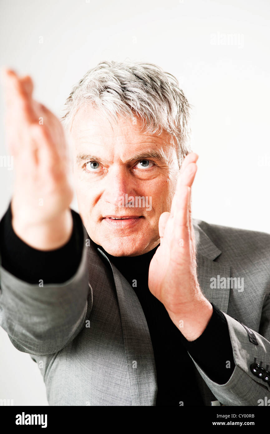 Businessman gesticulating in a specific direction Stock Photo - Alamy