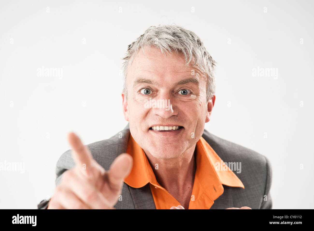 Smiling businessman, gesticulating Stock Photo - Alamy