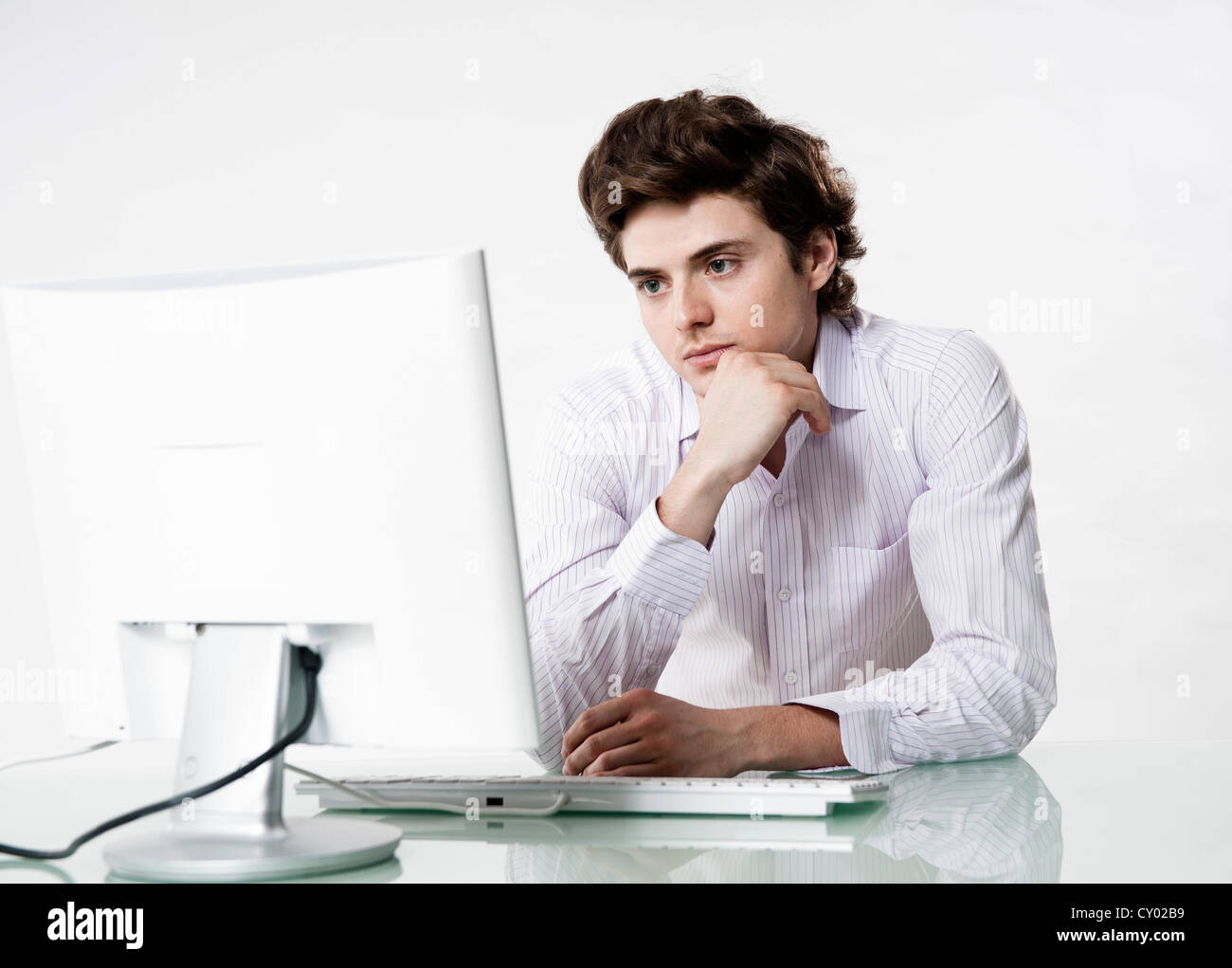 Concentrating in front monitor hi-res stock photography and images - Alamy