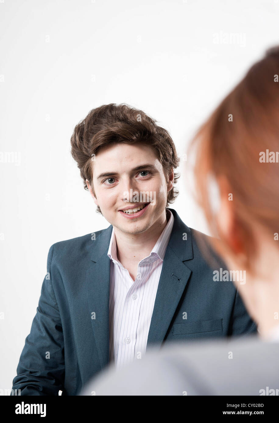 Young manager having a conversation with a colleague or client Stock ...