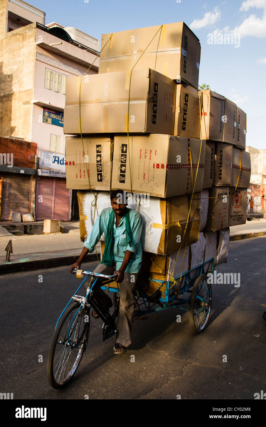 Heavily loaded bike, in the streets of Jaipur, the Pink City, Rajasthan ...