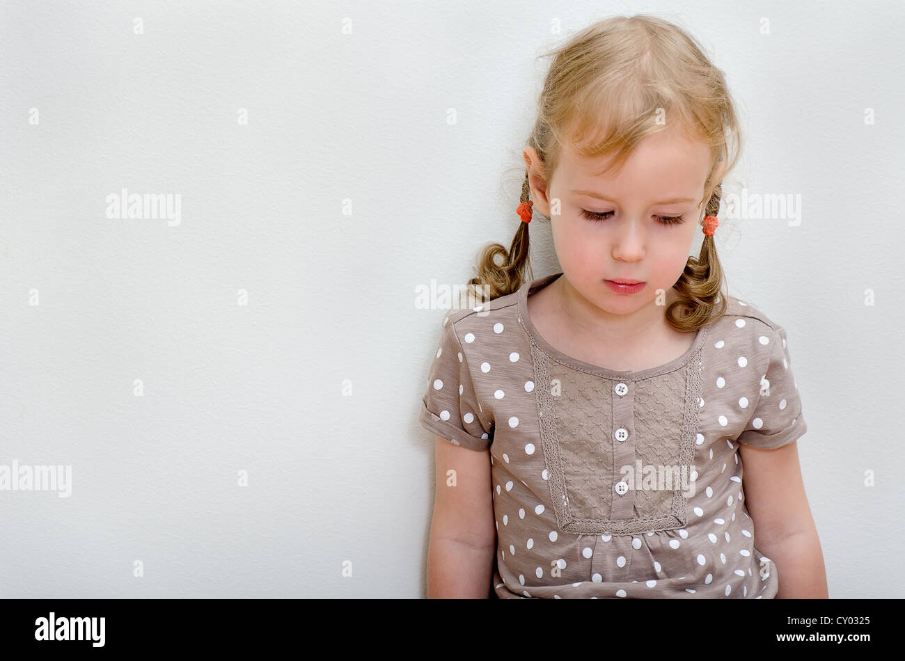 Girl child standing alone portrait sad hi-res stock photography and ...