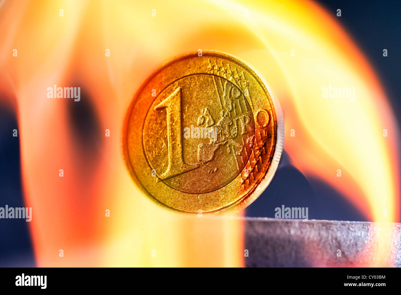 Euro coin burning hi-res stock photography and images - Alamy