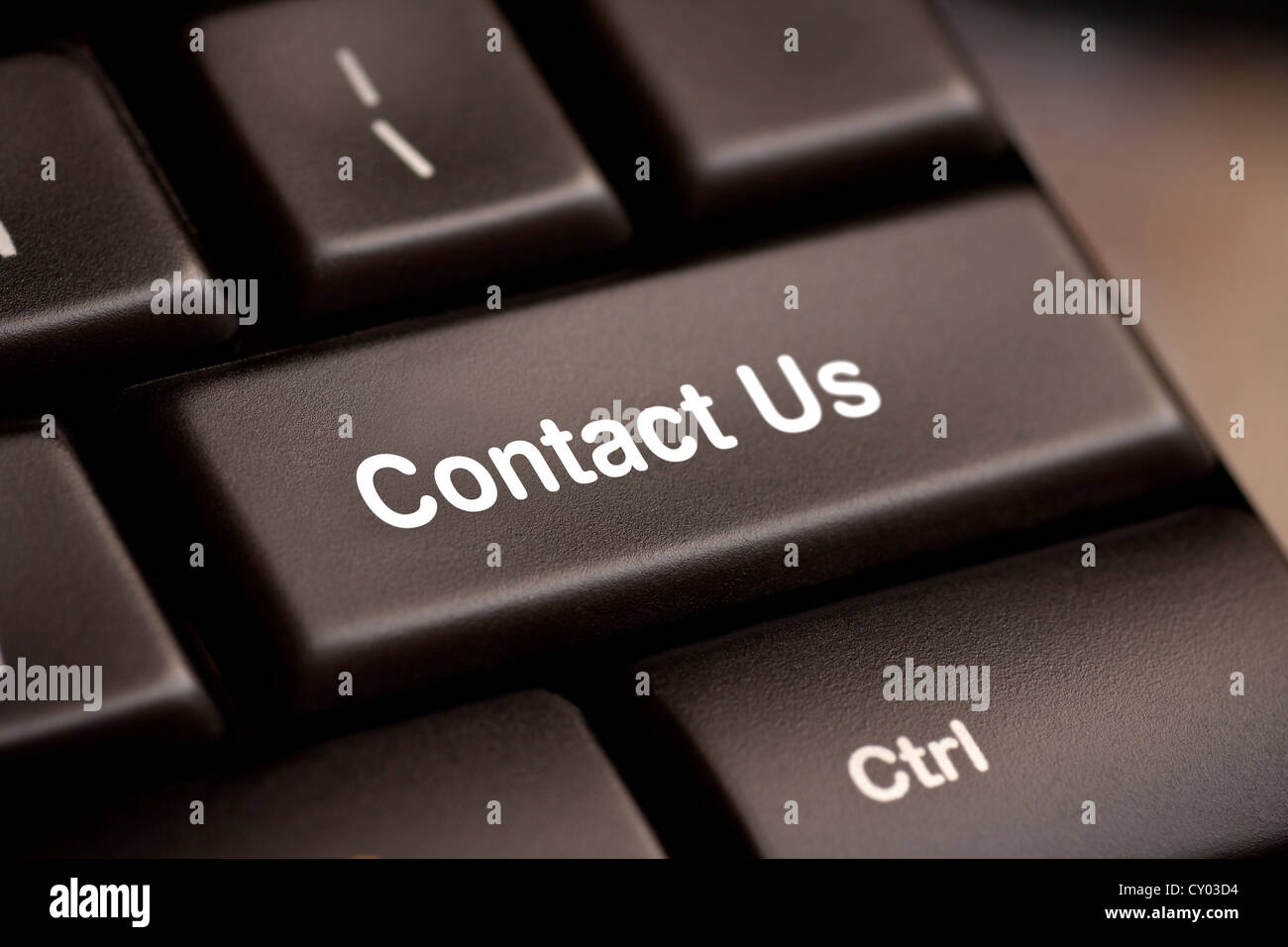 Keyboard with contact us key Stock Photo - Alamy