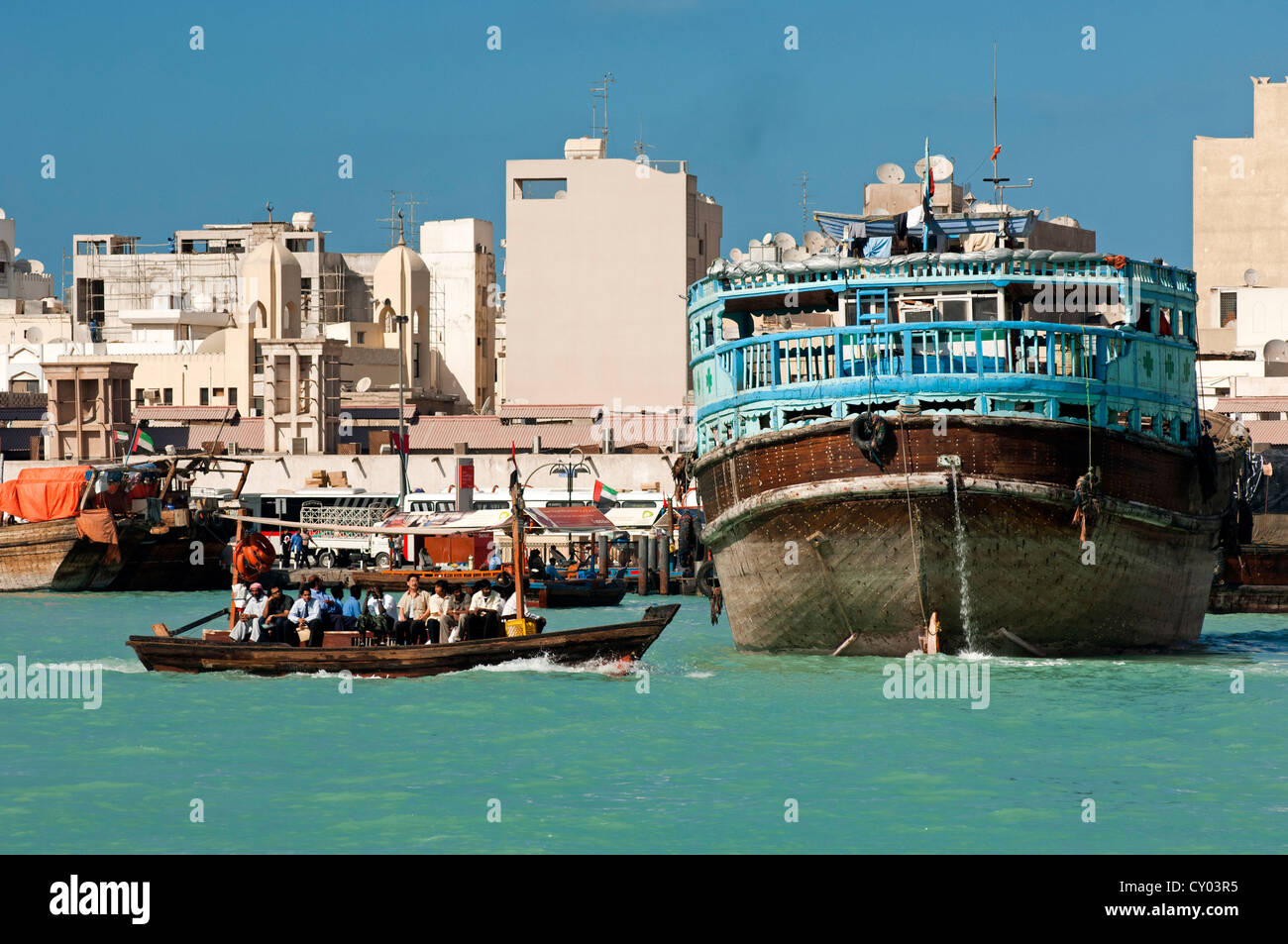 Abra water taxi and cargo ship on the Dubai Creek, Dubai, United Arab ...