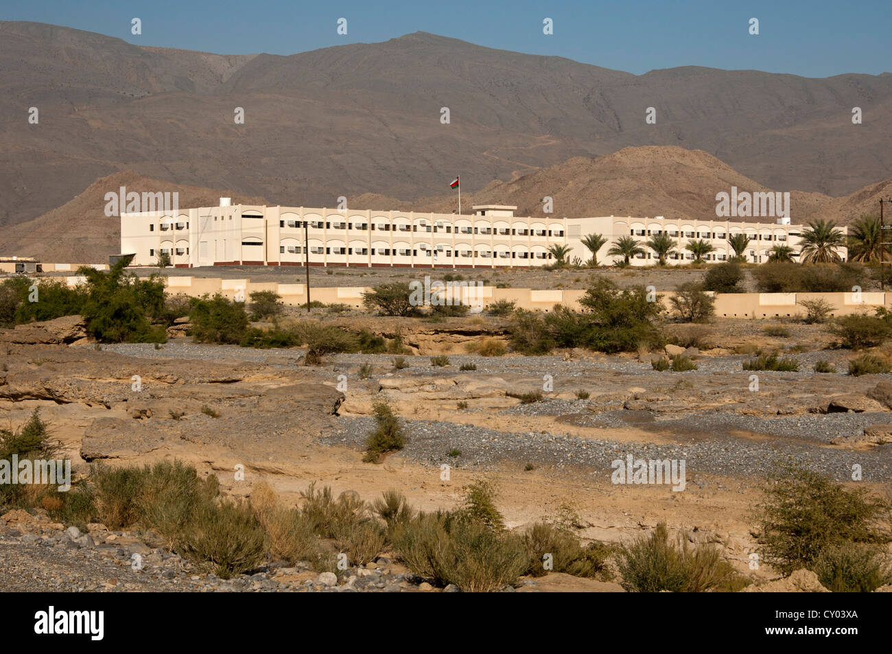 Modern school buildings in the barren landscape at the foot of the ...