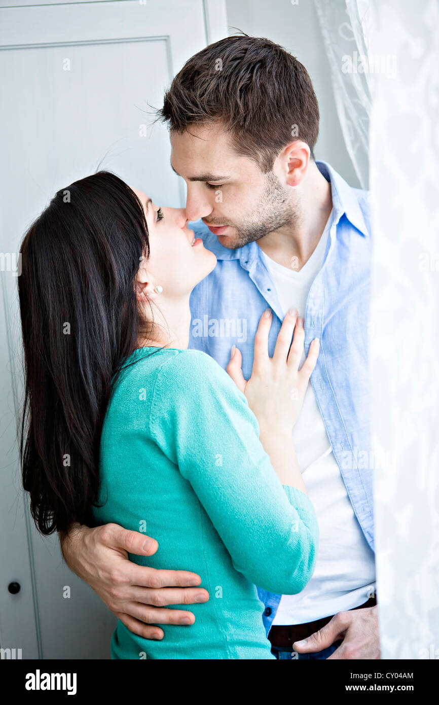 Loving couple stands closely hi-res stock photography and images - Alamy