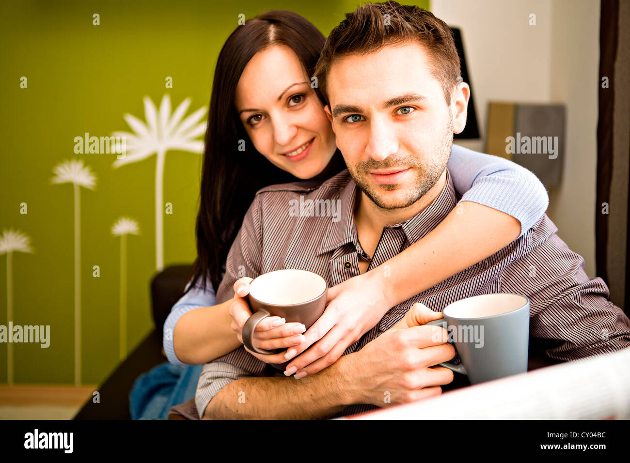 Happy young couple at home Stock Photo - Alamy
