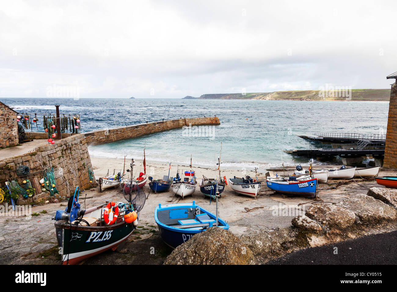 Fishing boats on dry land in Sennen Cove, Cornwall, moored up in ...