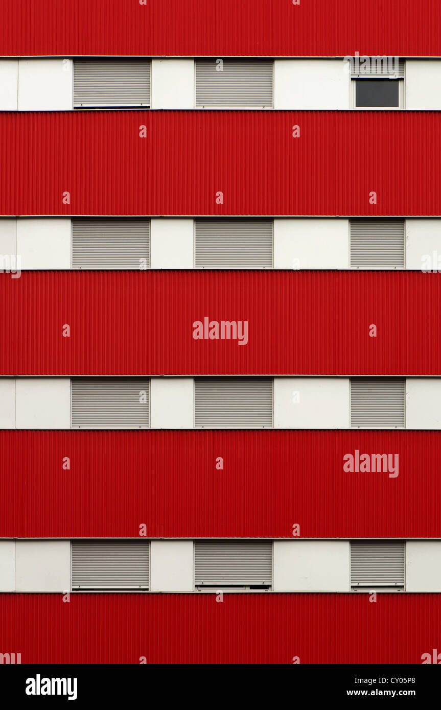 Red color facade and windows of a building Stock Photo - Alamy