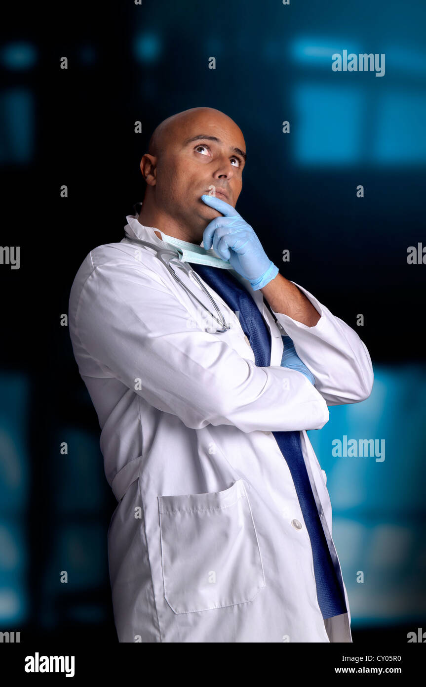 Doctor in a dark background Stock Photo - Alamy