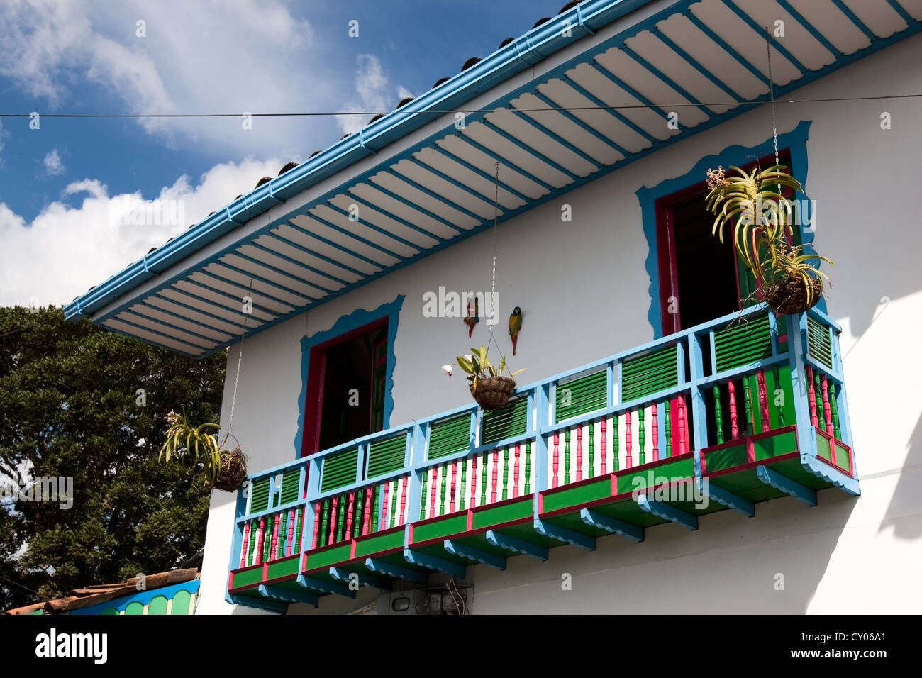 Balcony with flowers, Colourful building, Salento, Colombia Stock Photo ...
