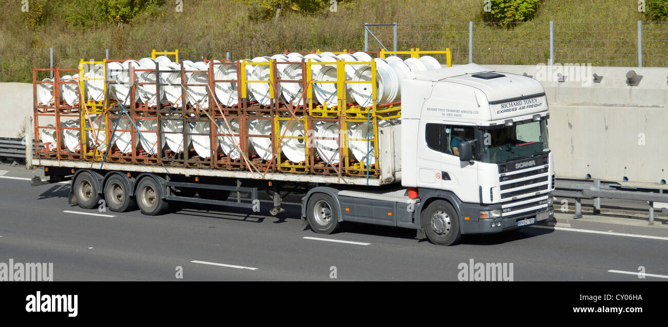 Articulated lorry trailer loaded with large diameter wheel hub ...