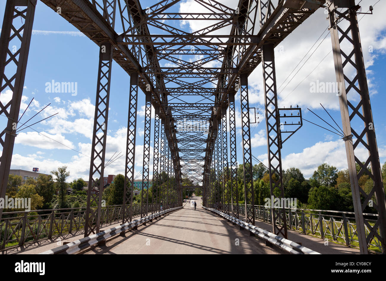 Old arched metal bridge in Novgorod region, Russia. View from inside ...