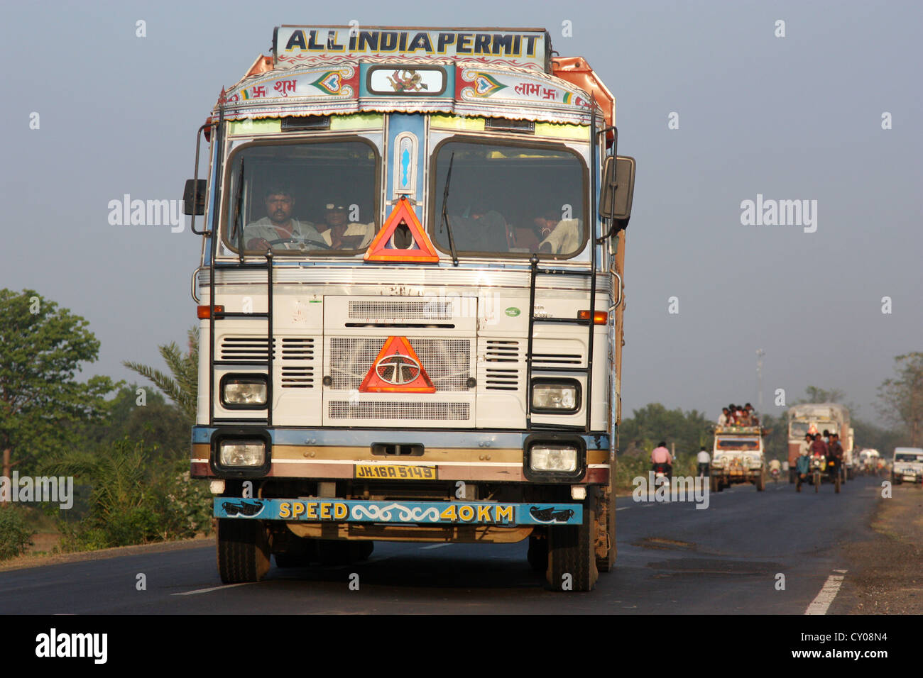 Indian Tata 3118C heavy truck travelling down Bengali highway at sunset ...