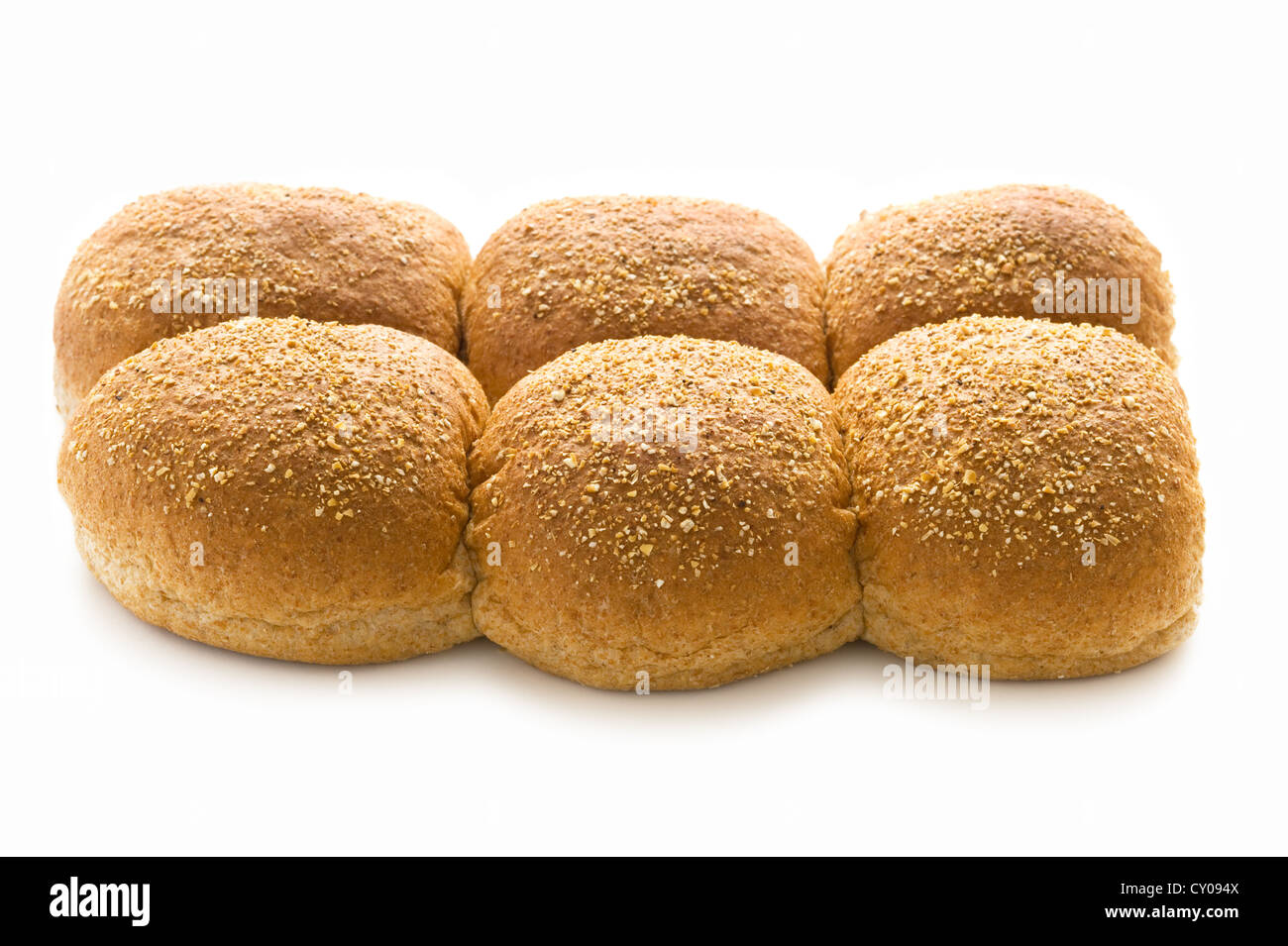 wholewheat bread rolls with bran topping isolated on a white background ...