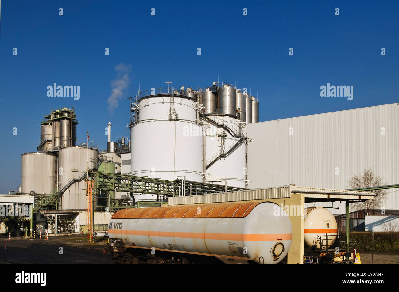 Industrial manufacturing plant with tank cars and chimneys, North Rhine ...