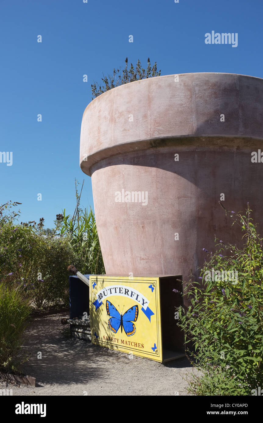 Giant terracotta pot & matchbox in a modern garden at Butterfly World ...