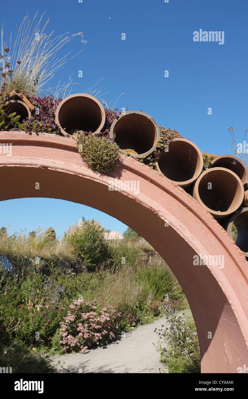 Terracotta Arch in a modern garden at Butterfly World, St Albans ...