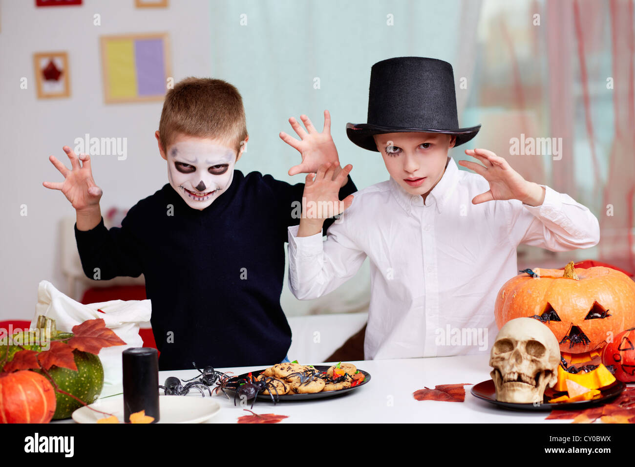 Photo of twin eerie boys looking at camera with frightening look Stock ...