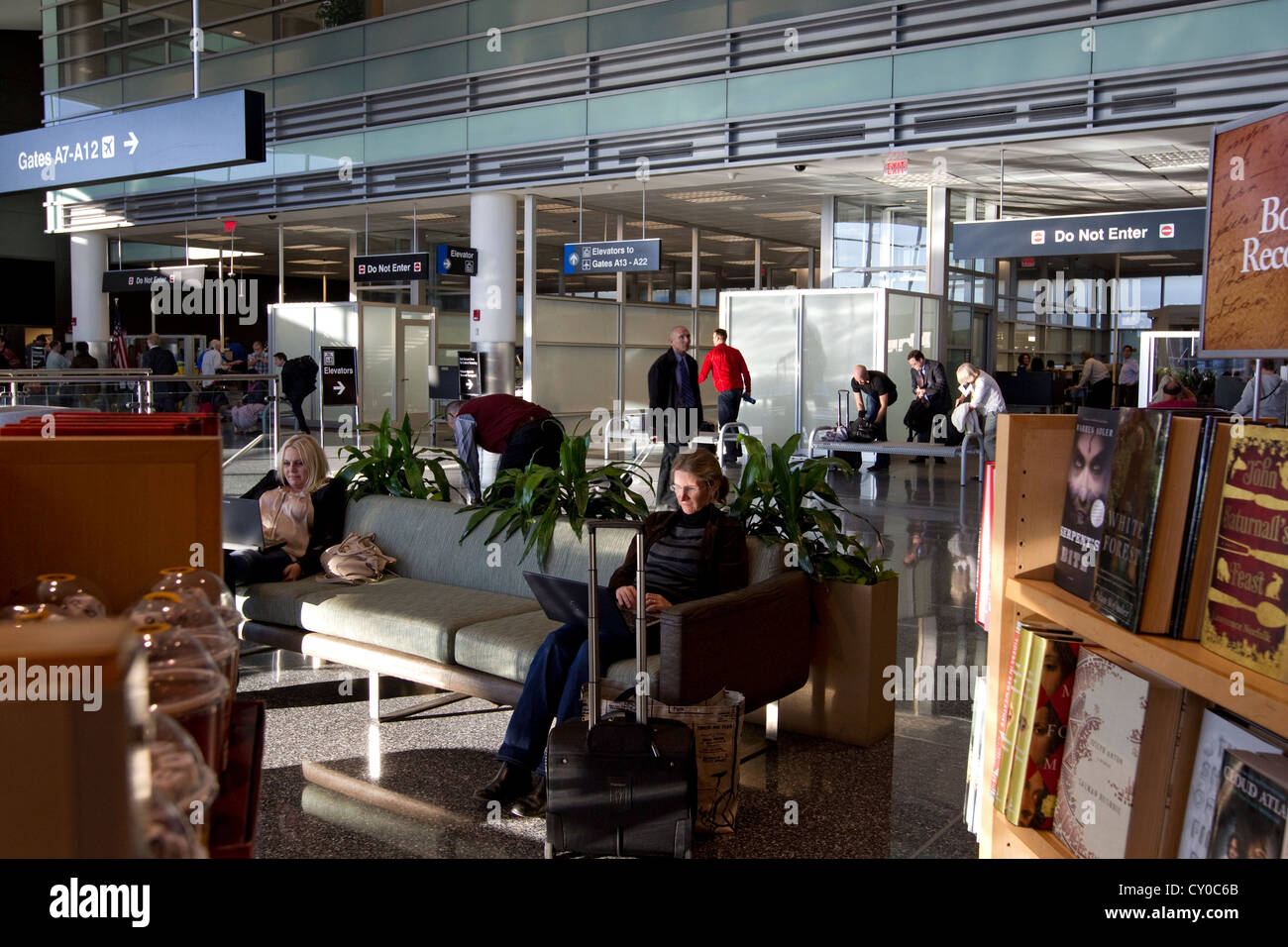 Passengers wait in airport terminal, airport security, SeaTac Airport ...