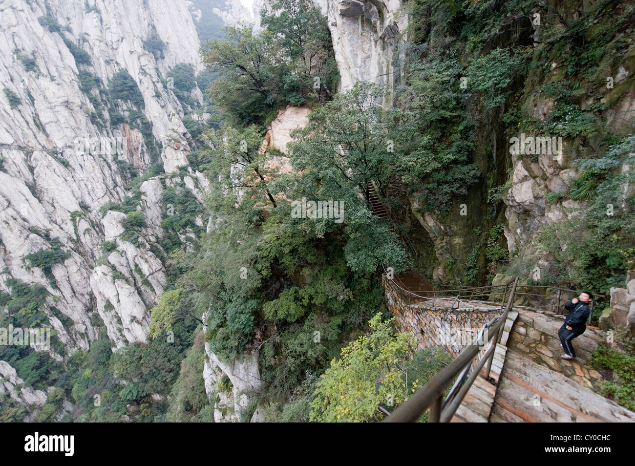 A man performing kung fu on the trail to the San Huang Zhai Monastery ...