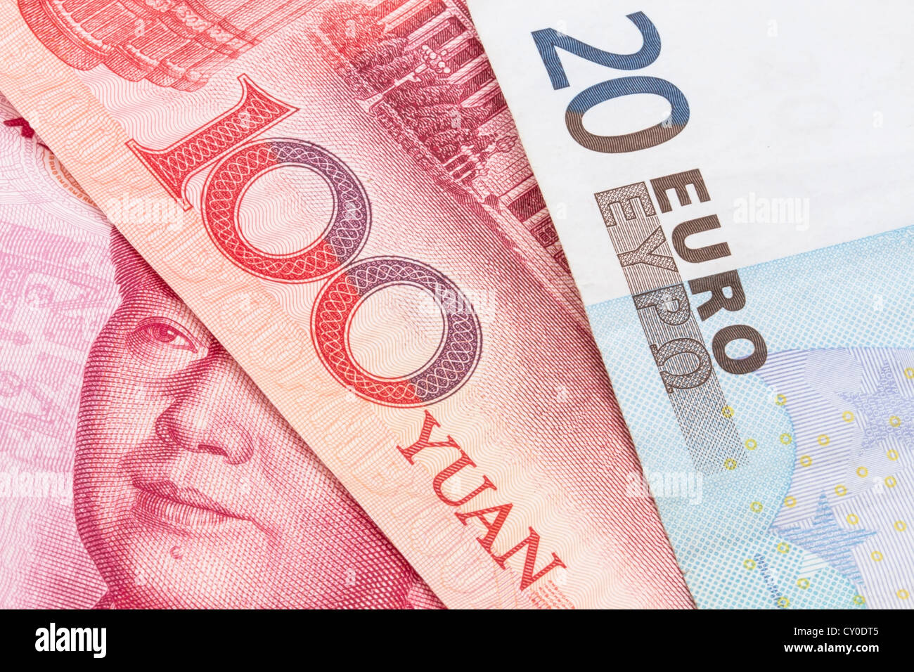 Yuan and Euro currency closeup on white background Stock Photo - Alamy