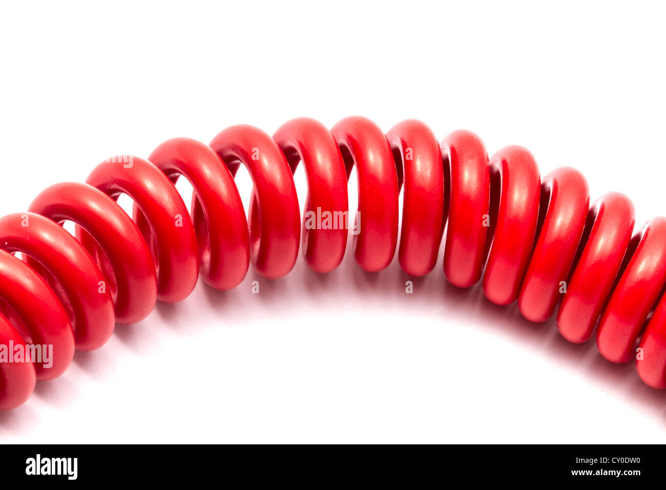 Red cable isolated on white background Stock Photo - Alamy