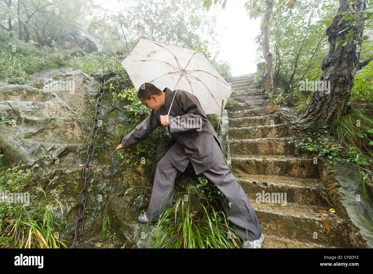 Shaolin Monk Shi De Jian examining vegetation at the San Huang Zhai ...