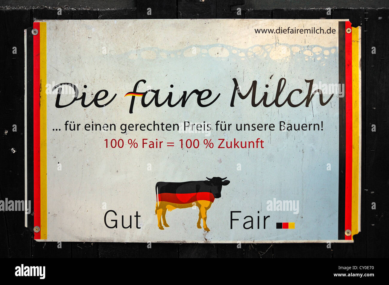 Poster, lettering "Die faire Milch", German for "Fair Milk" on a cow ...
