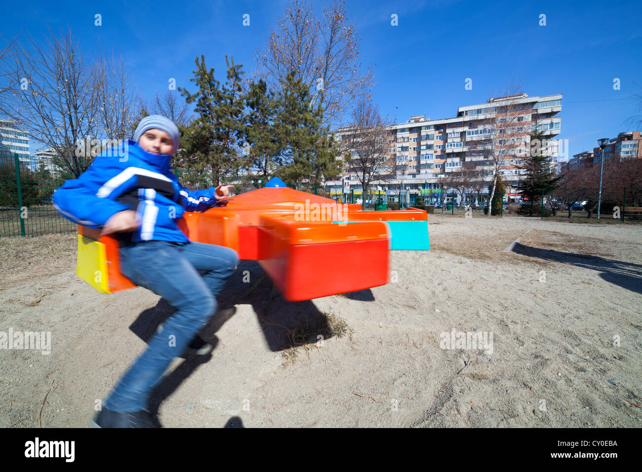 One child spinning playground hi-res stock photography and images - Alamy