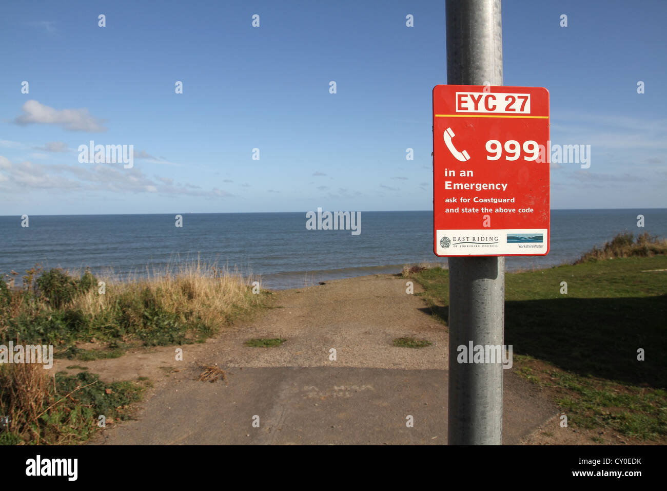 Coastguard danger sign on cliff edge Stock Photo - Alamy