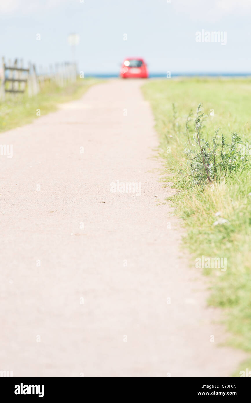 Distant car parked by lake in scenic landscape at summer Stock Photo ...