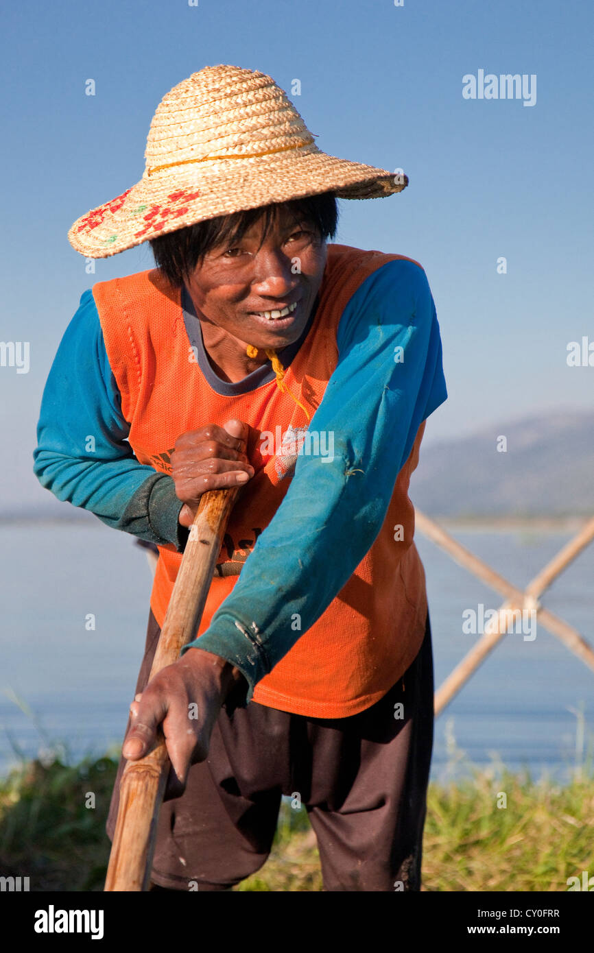 Myanmar, Burma. Inle Lake, Shan State. Burmese Man Using Long Pole to ...