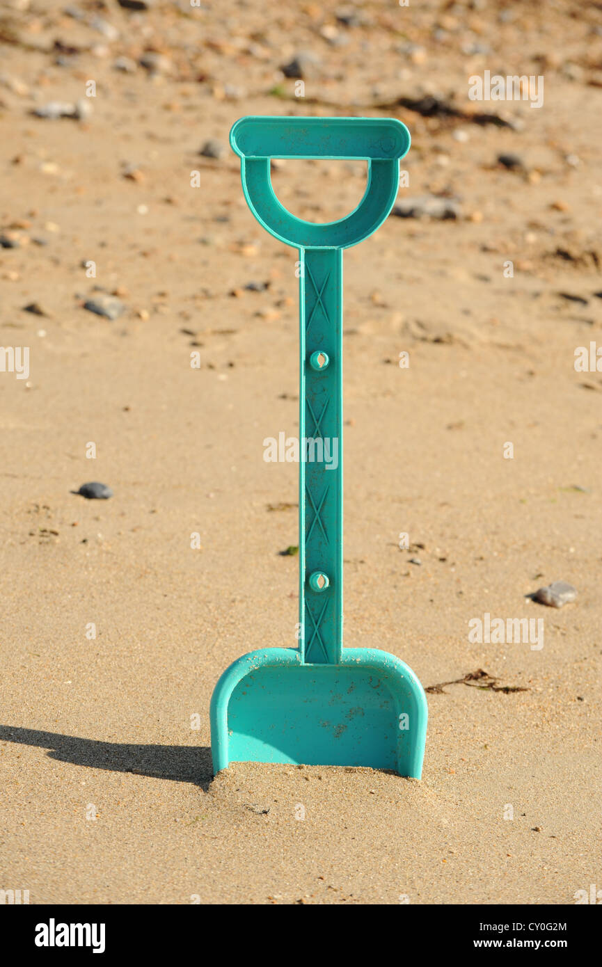 Spade at the seaside Stock Photo - Alamy