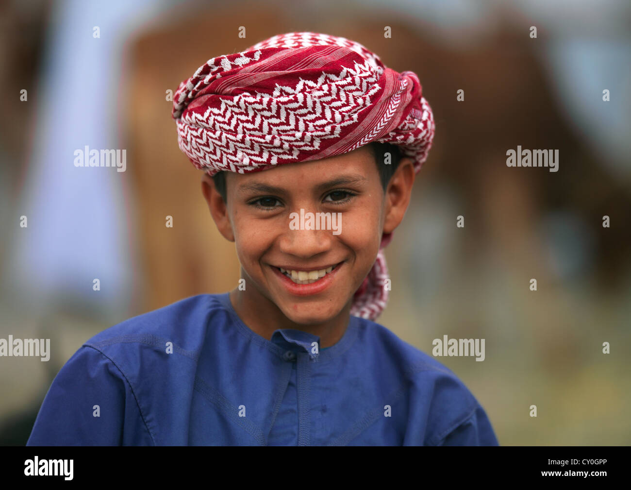 A Smiling Bedouin Kid Wearing Turban, Nizwa, Oman Stock Photo - Alamy