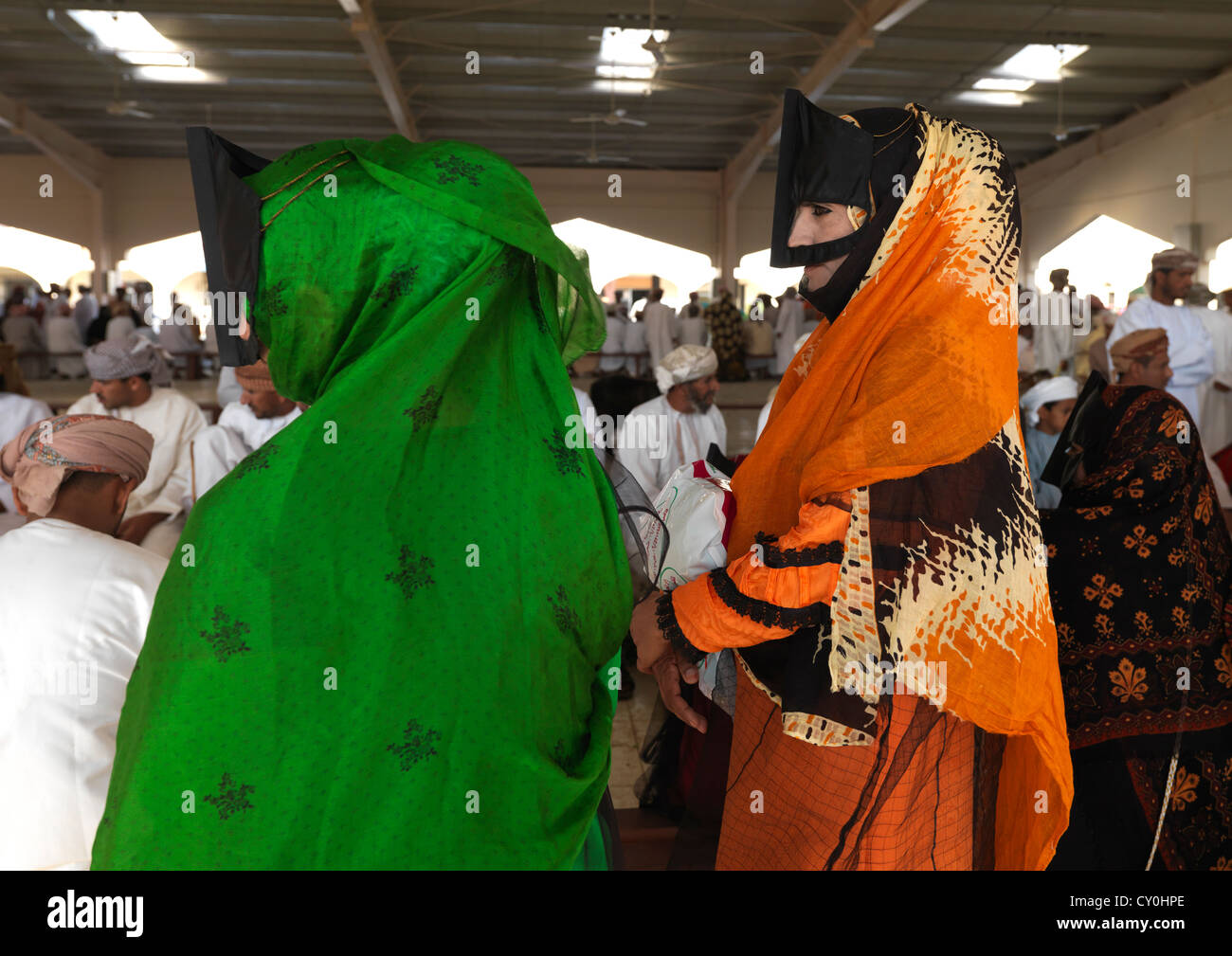 Two Bedouin Women In Colourful Burqa, Sinaw Fish Market, Oman Stock ...