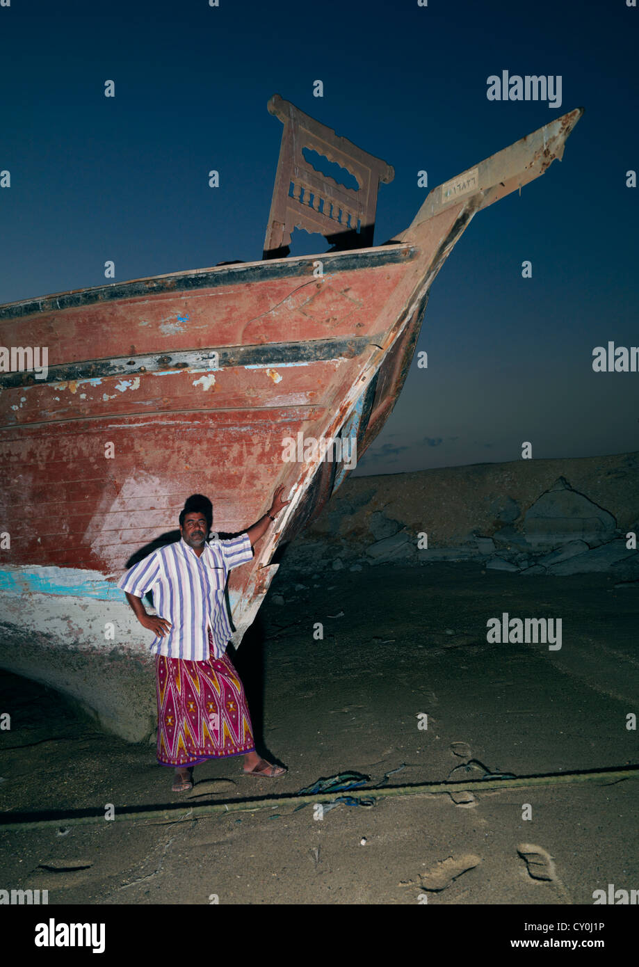 Man Standing Beside The Dhow In Masirah Island, Oman Stock Photo - Alamy