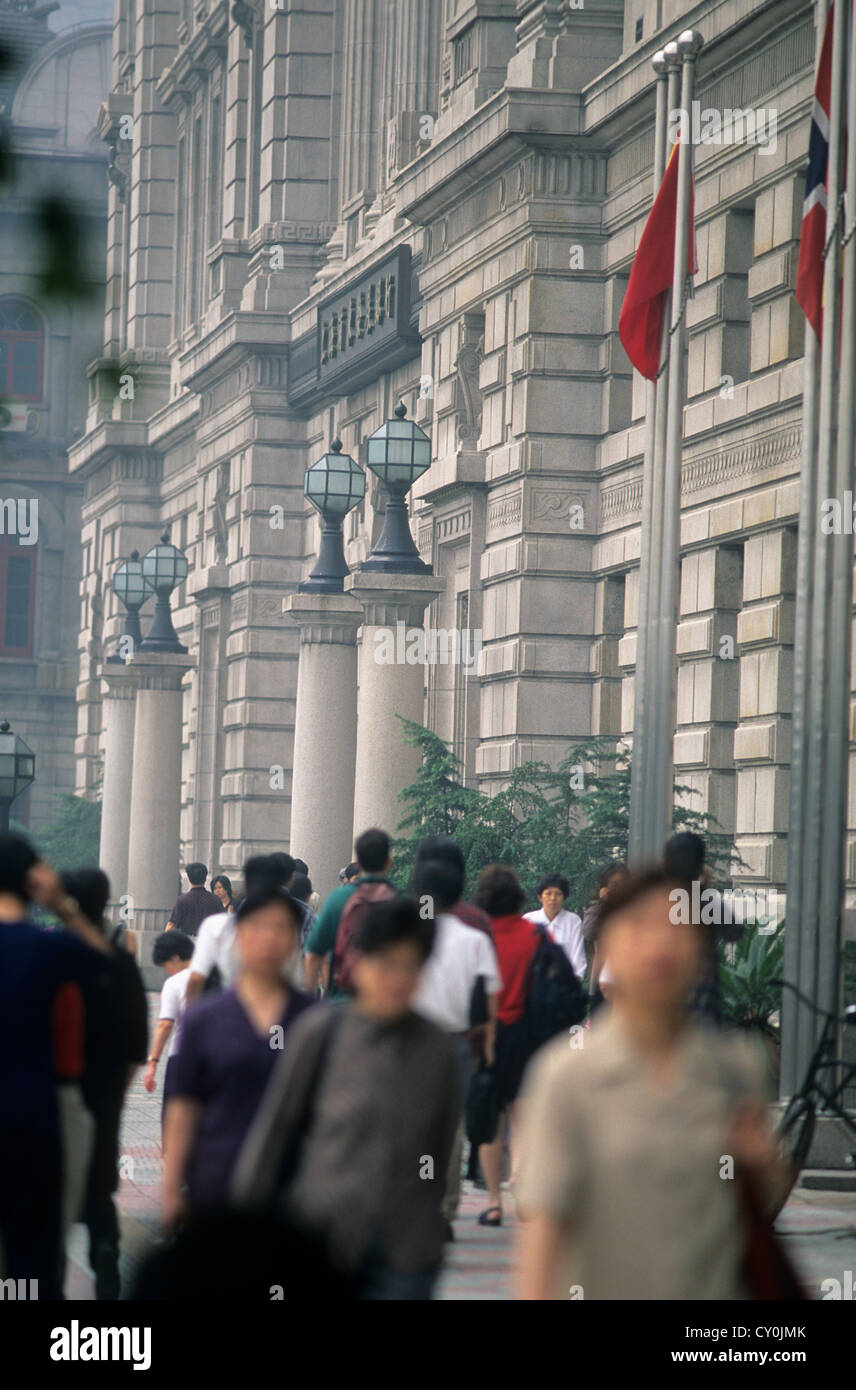 China, Shanghai, the Bund, pedestrians along the walkway outside the ...