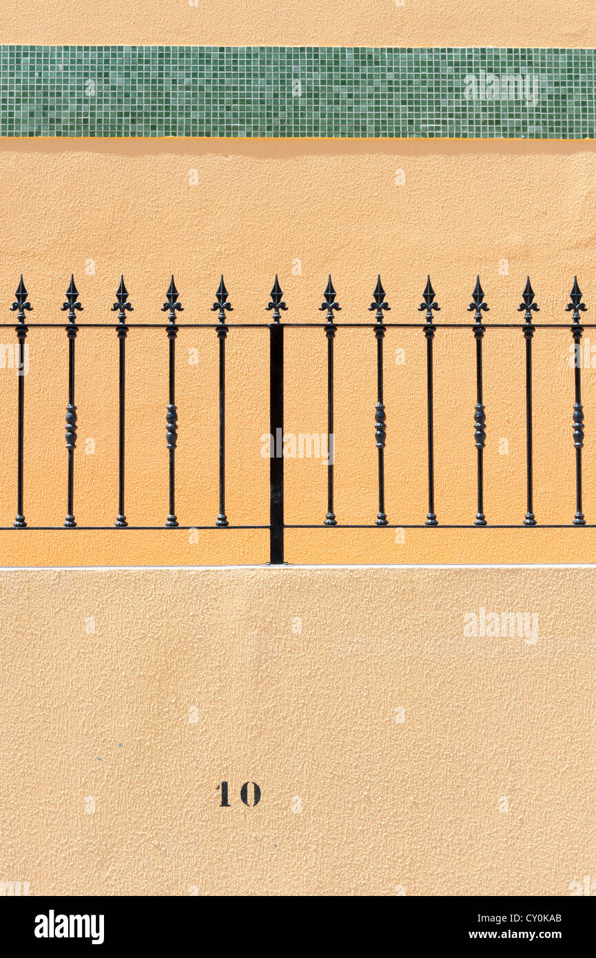 Abstract image of wall and railings or fence. Colourful Spanish style ...
